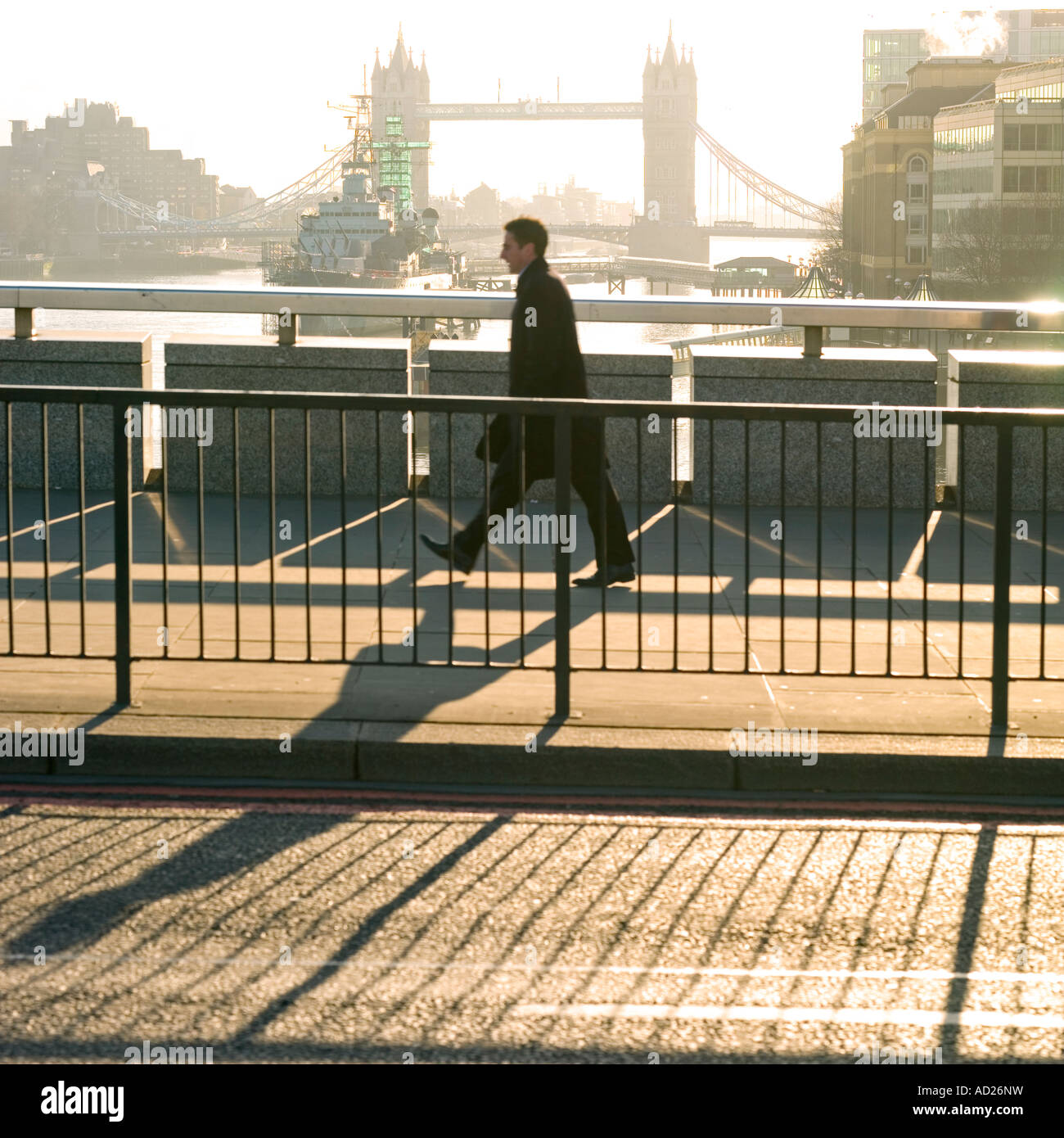 Going to work early morning office workers walking over London Bridge ...