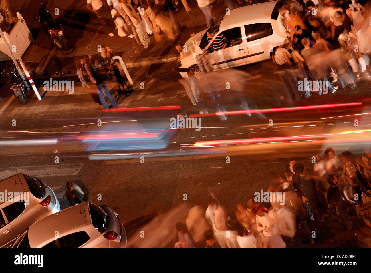 long exposure shot of a large crowd forming outside a disco in ...