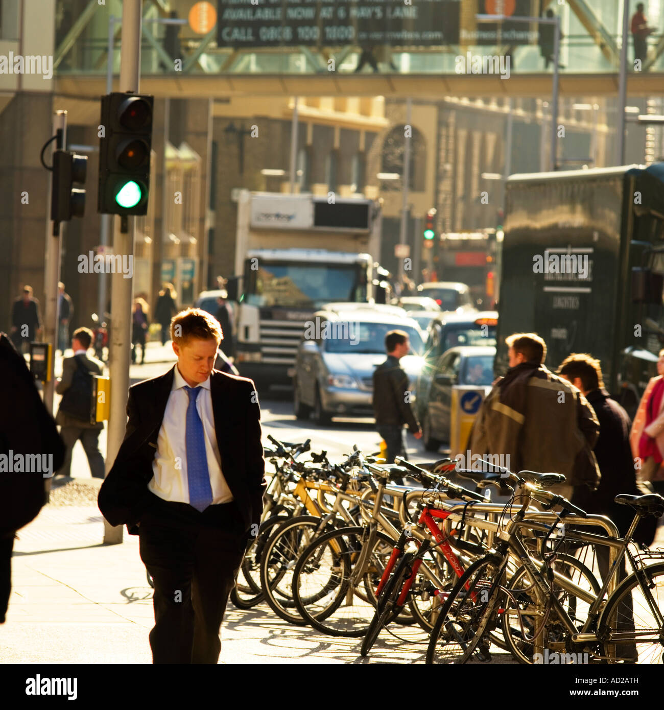 Going to work early morning office workers walking towards London ...