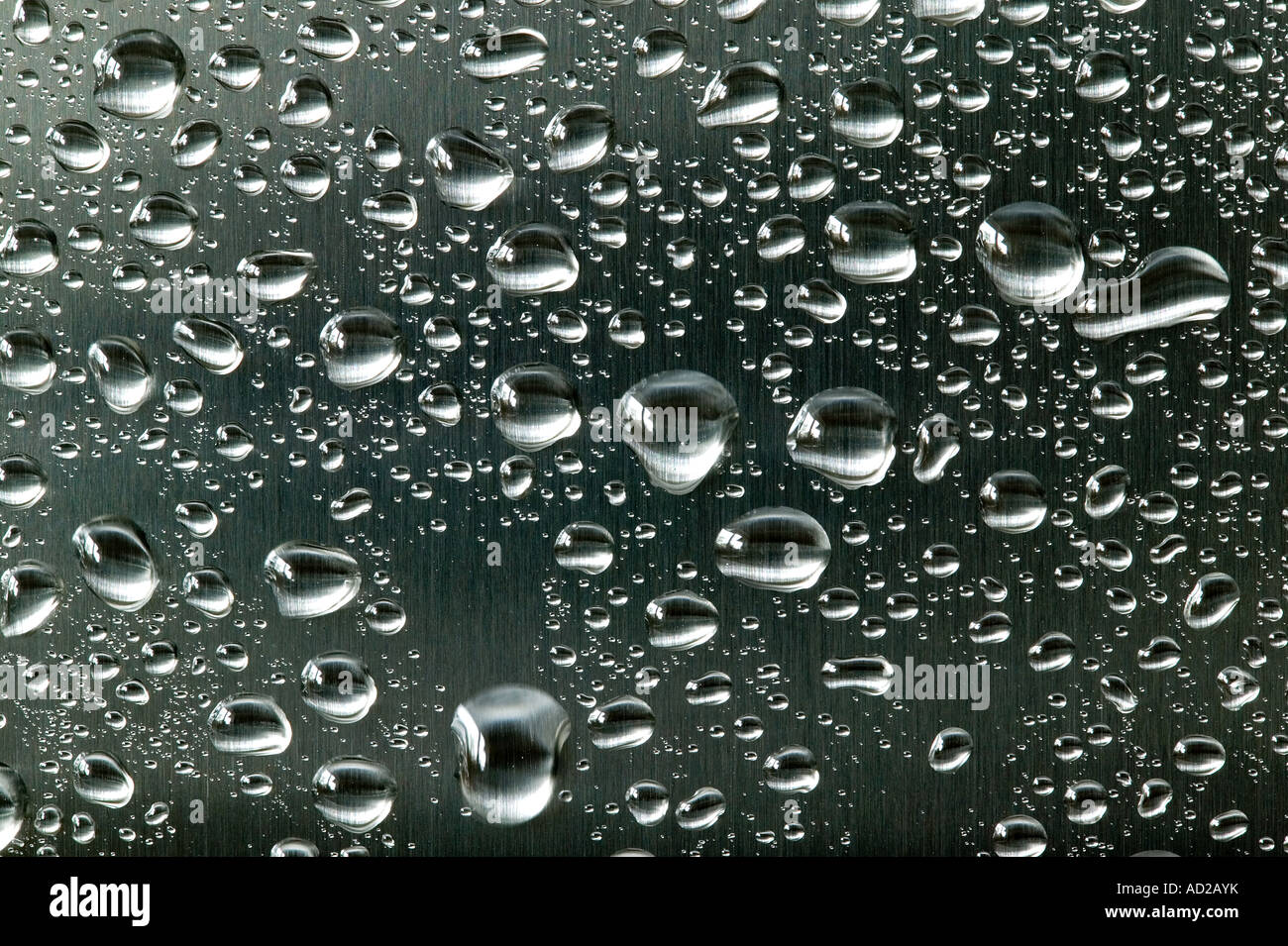 Water droplets on a brushed steel surface Stock Photo - Alamy