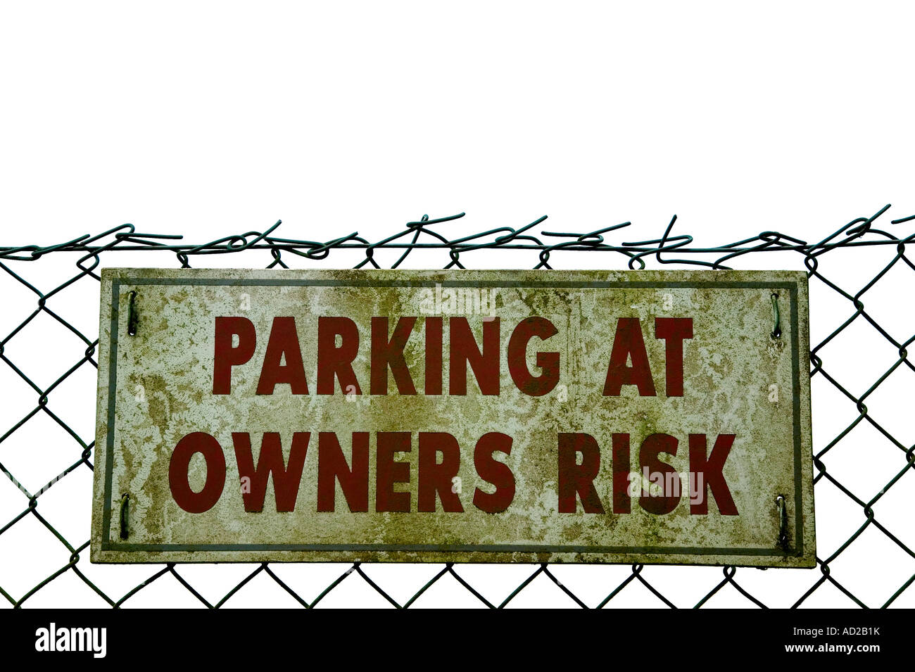 Grungey old Parking sign on a wire fence isolated on white Stock Photo ...
