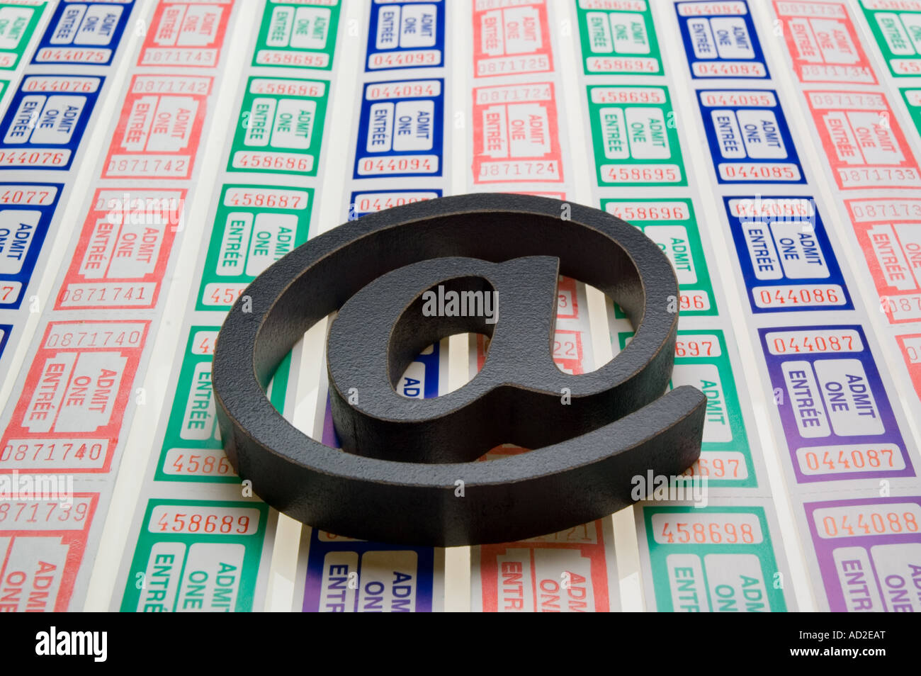 Arobase @ symbol on top on admit one tickets Stock Photo - Alamy