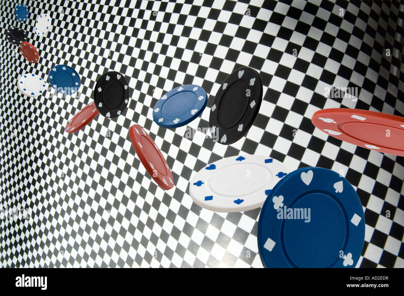 Poker chips floating over checker board design Stock Photo - Alamy