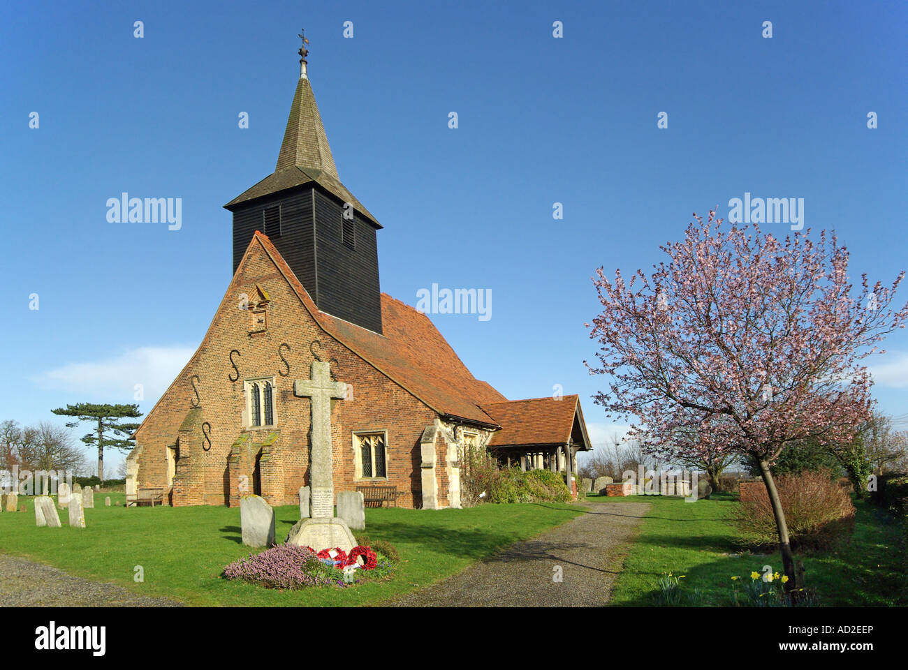 Mountnessing rural Parish Church and tower with war memorial note large ...
