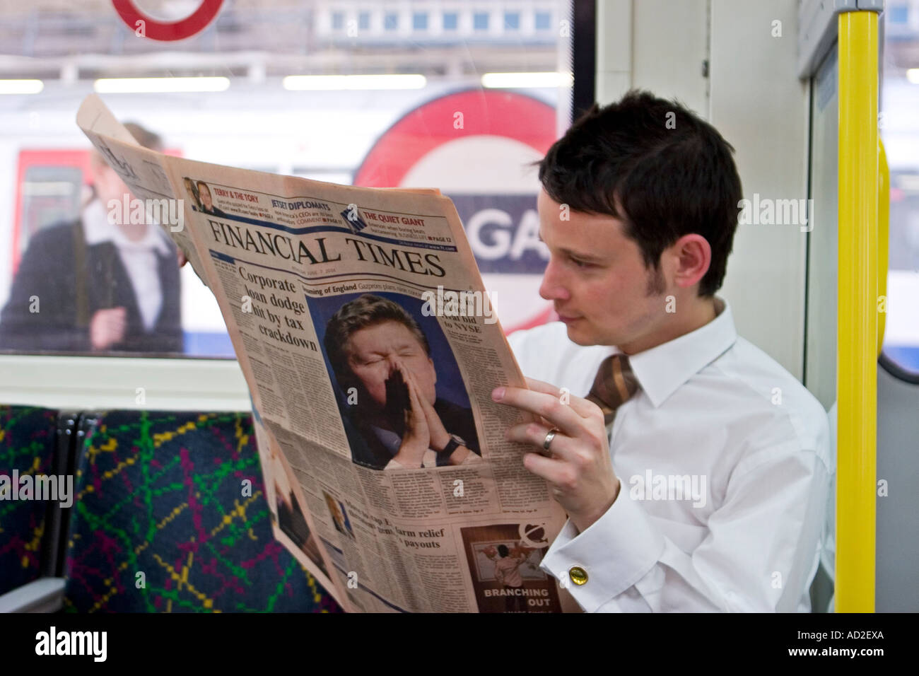 Newspaper on the tube hi-res stock photography and images - Alamy