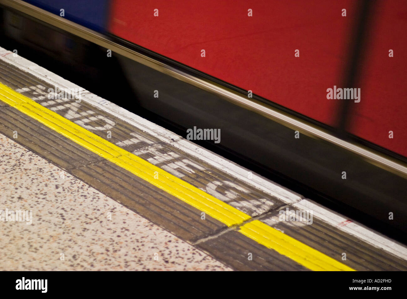 Tube train enters station London Underground With mind the gap sign on ...