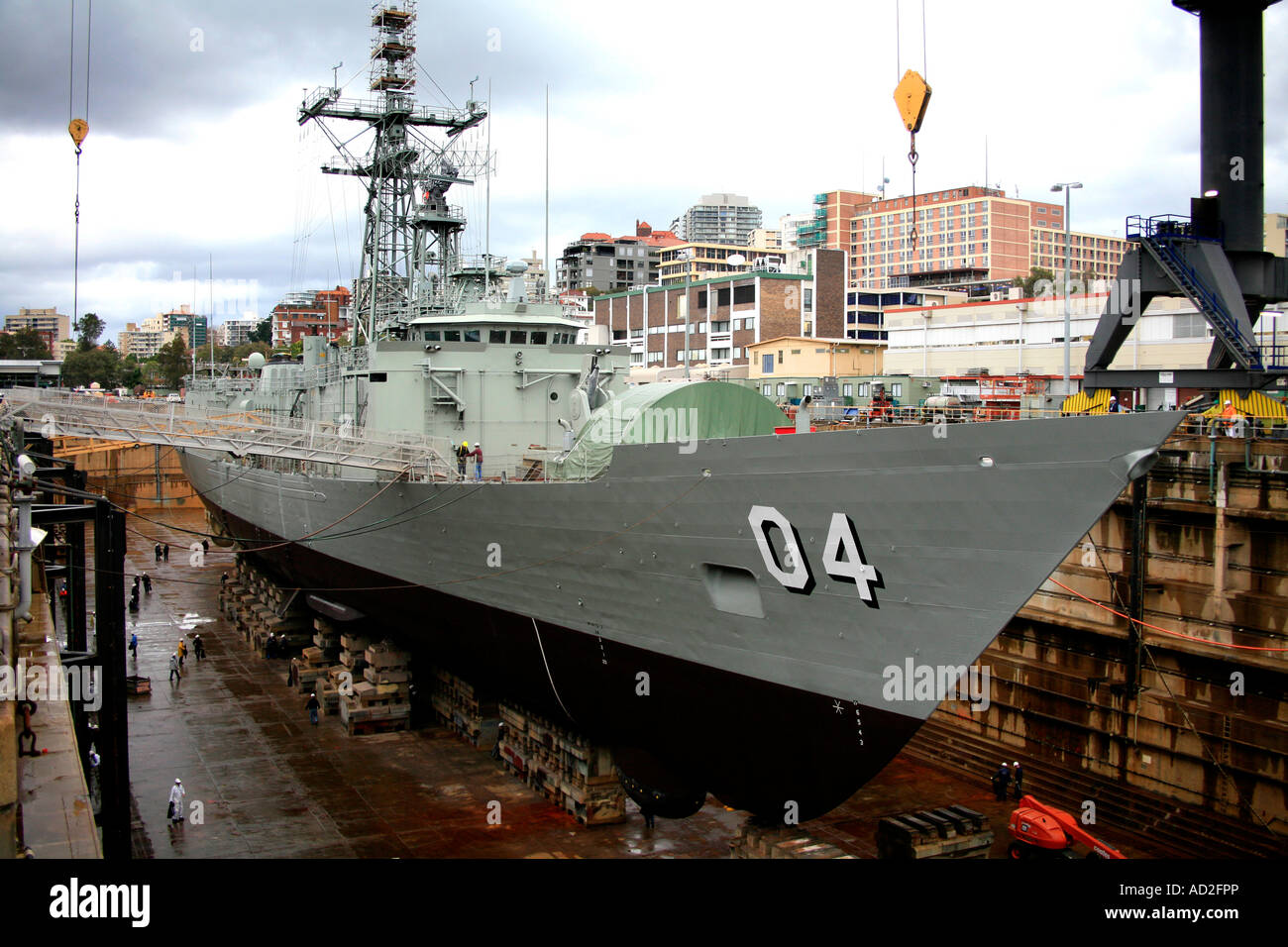 A frigate is prepared for sea after undergoing a refit at Garden Island ...