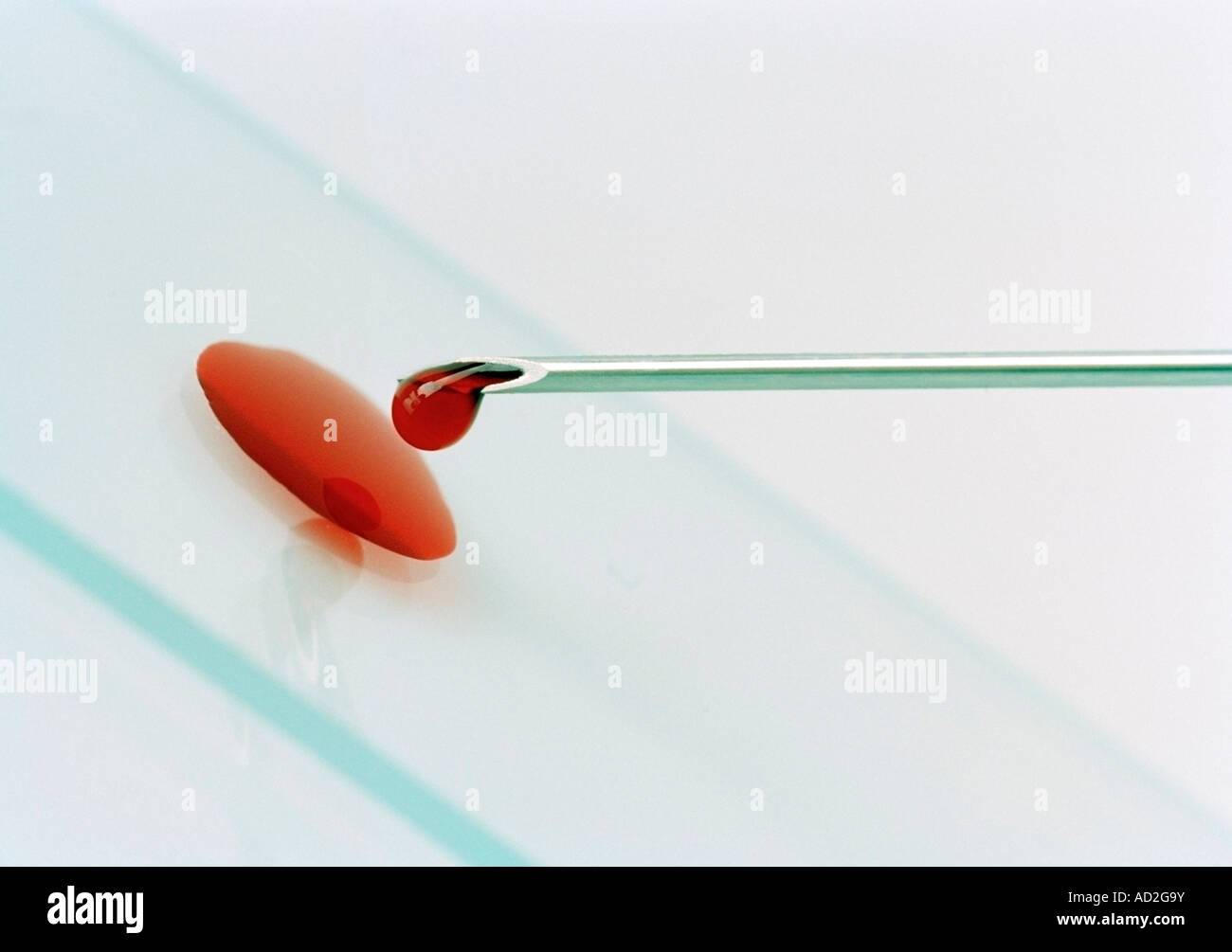 Syringe placing a blood sample on a slide, angled Stock Photo - Alamy