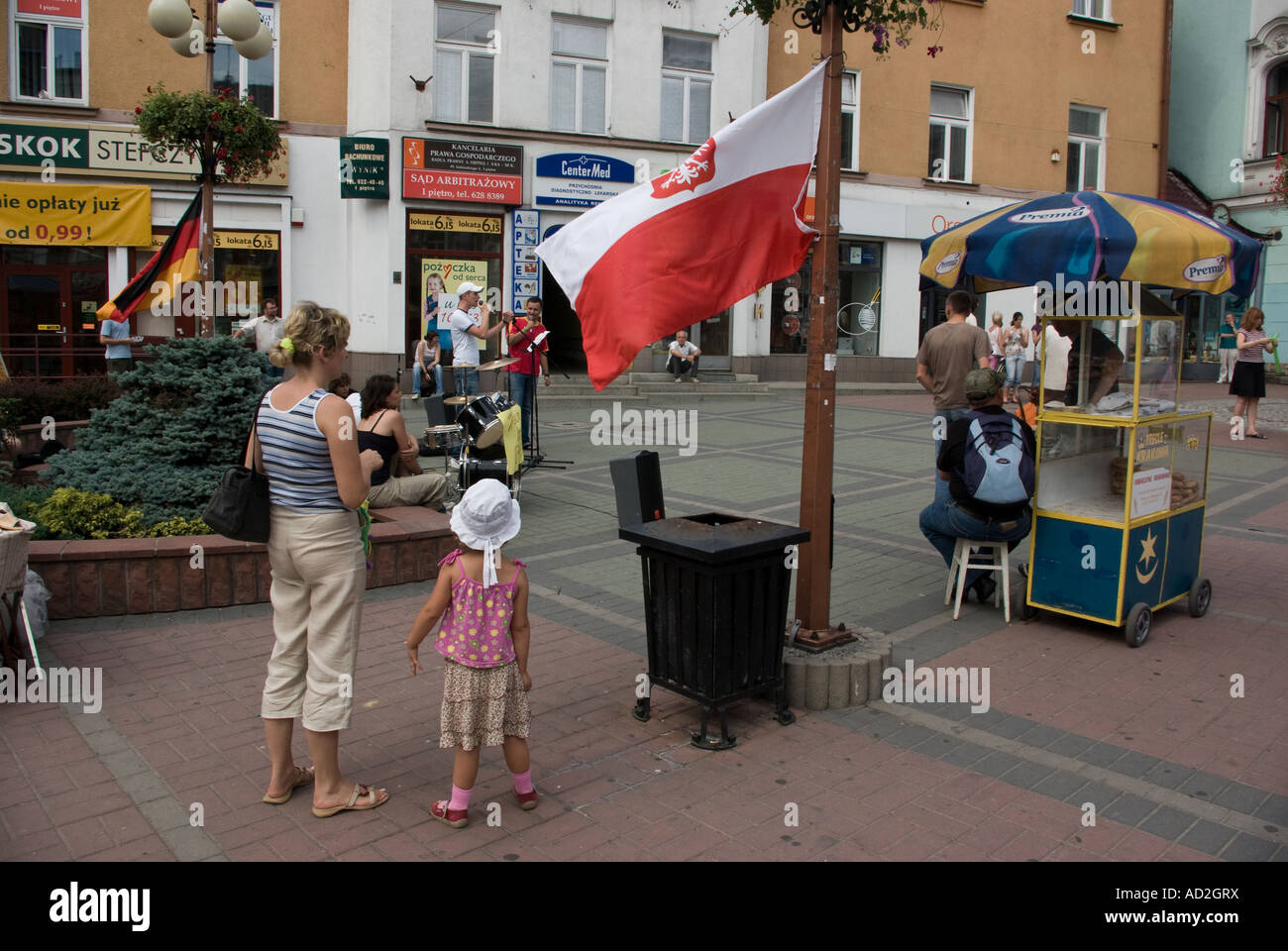 The main area of a small Polish town. A mother and daughter, the Polish ...
