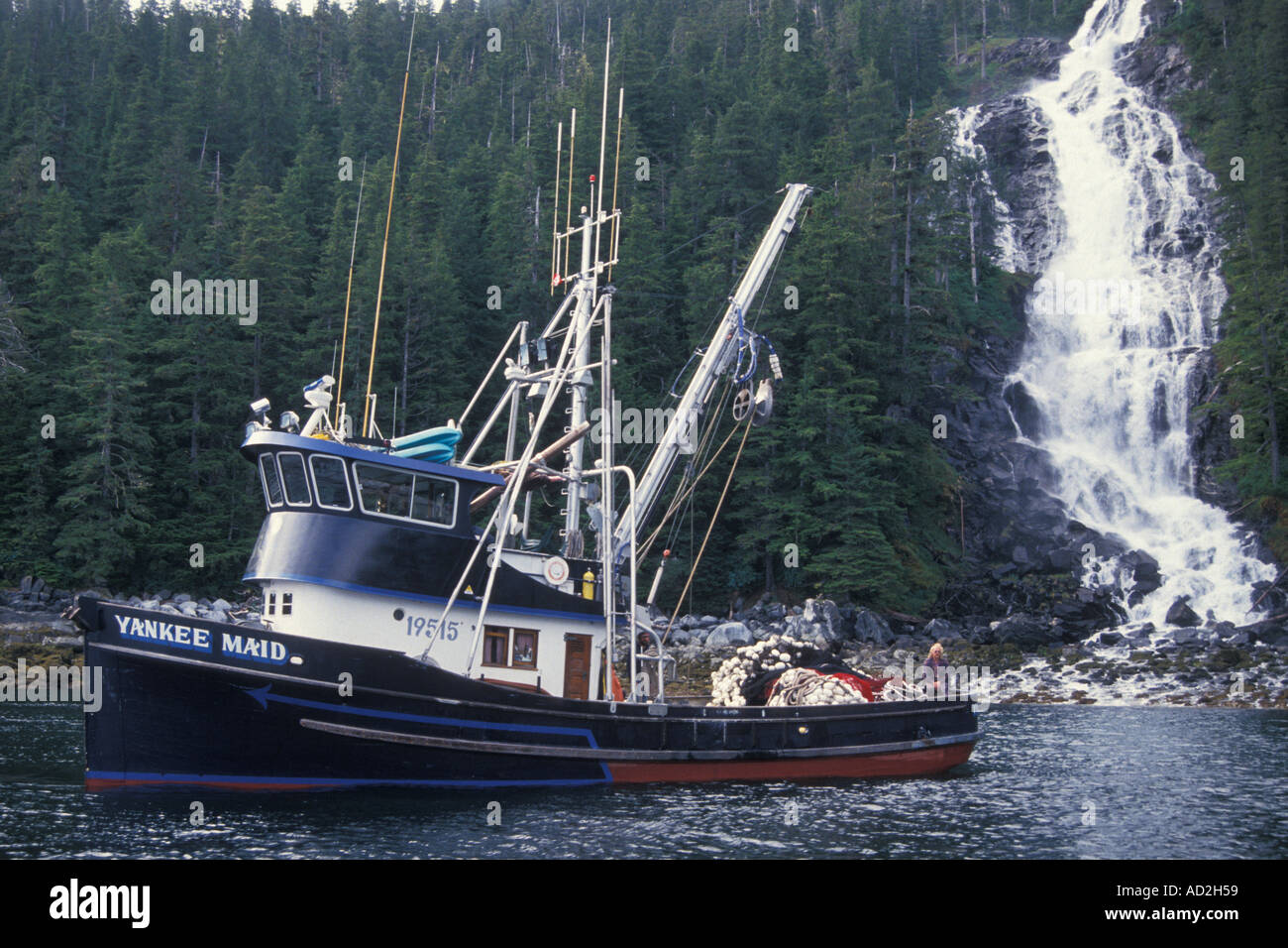 commercial fishing boat Yankee Maid next to a waterfall in southeast ...