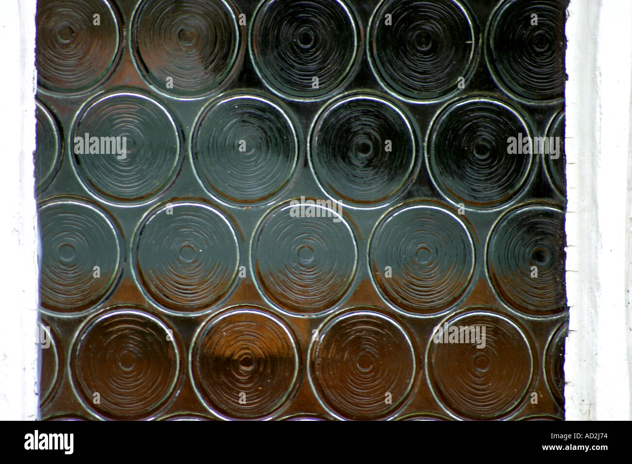 Circular pattern on glass window pane Stock Photo - Alamy