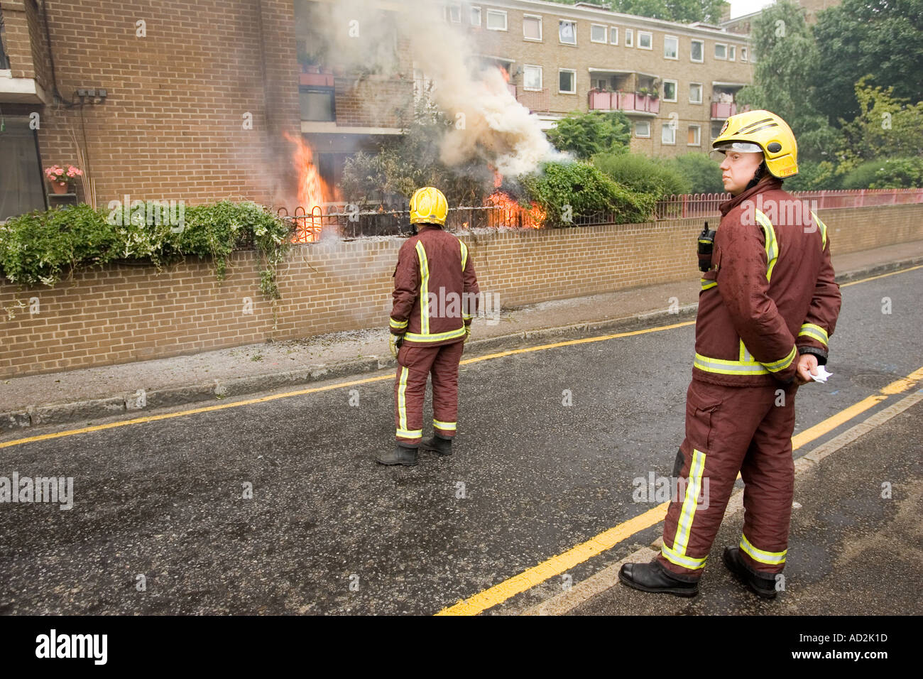 Fire brigade waiting for the water lorry to arrive closer to the fire ...