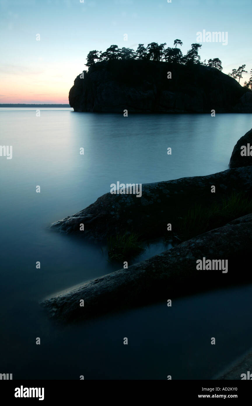 Summer evening at the small island Slottsholmen in the lake Vansjø in ...