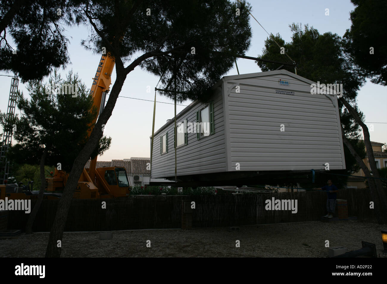 Lifting a static caravan into position Spain Stock Photo - Alamy