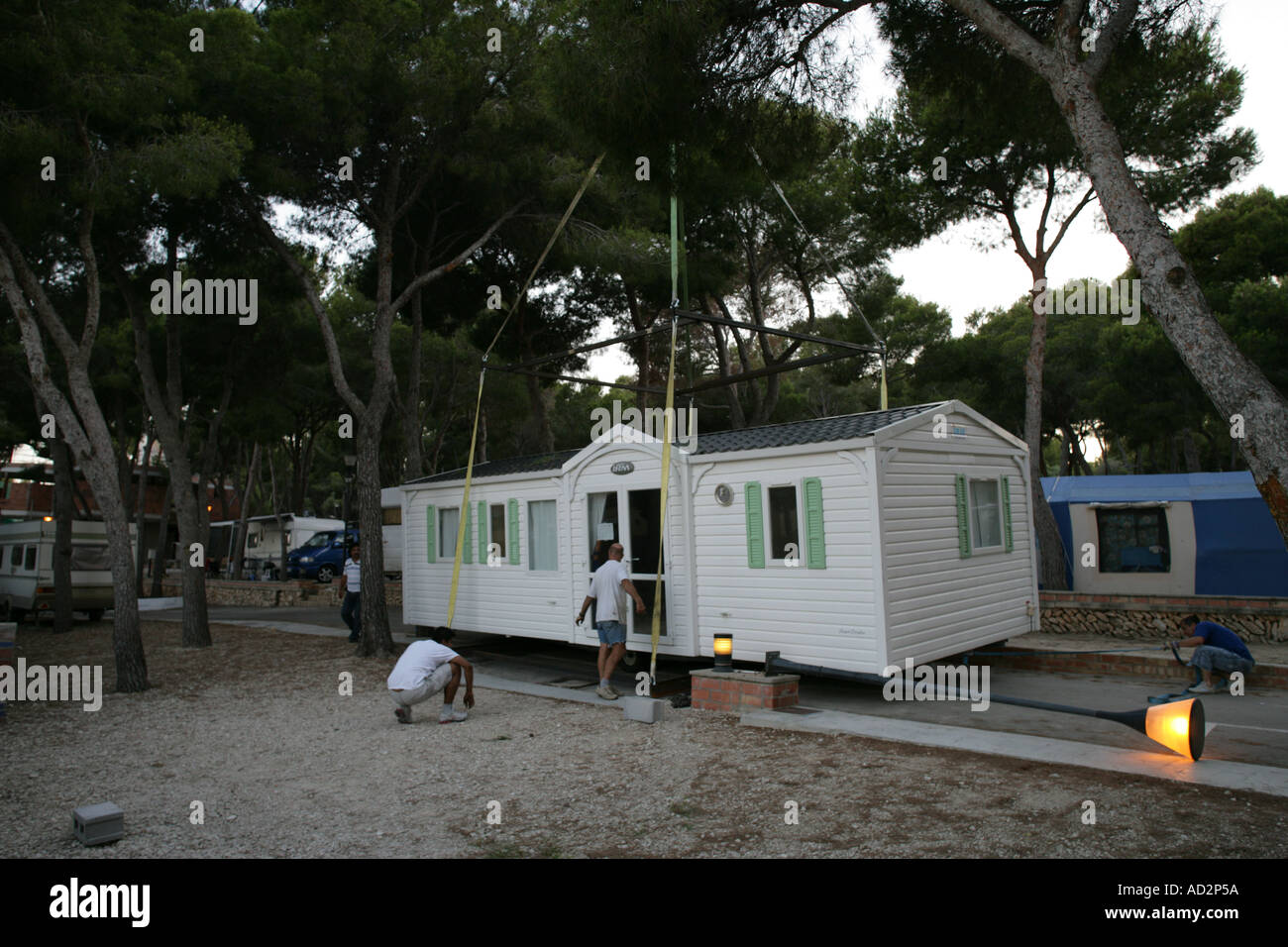 Lifting a static caravan into position spain Stock Photo - Alamy