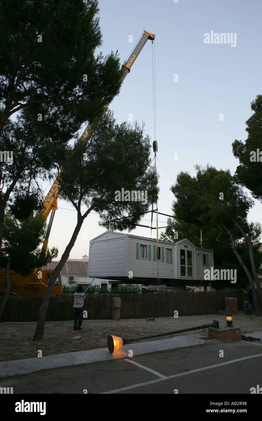Lifting a static caravan into position Spain Stock Photo - Alamy