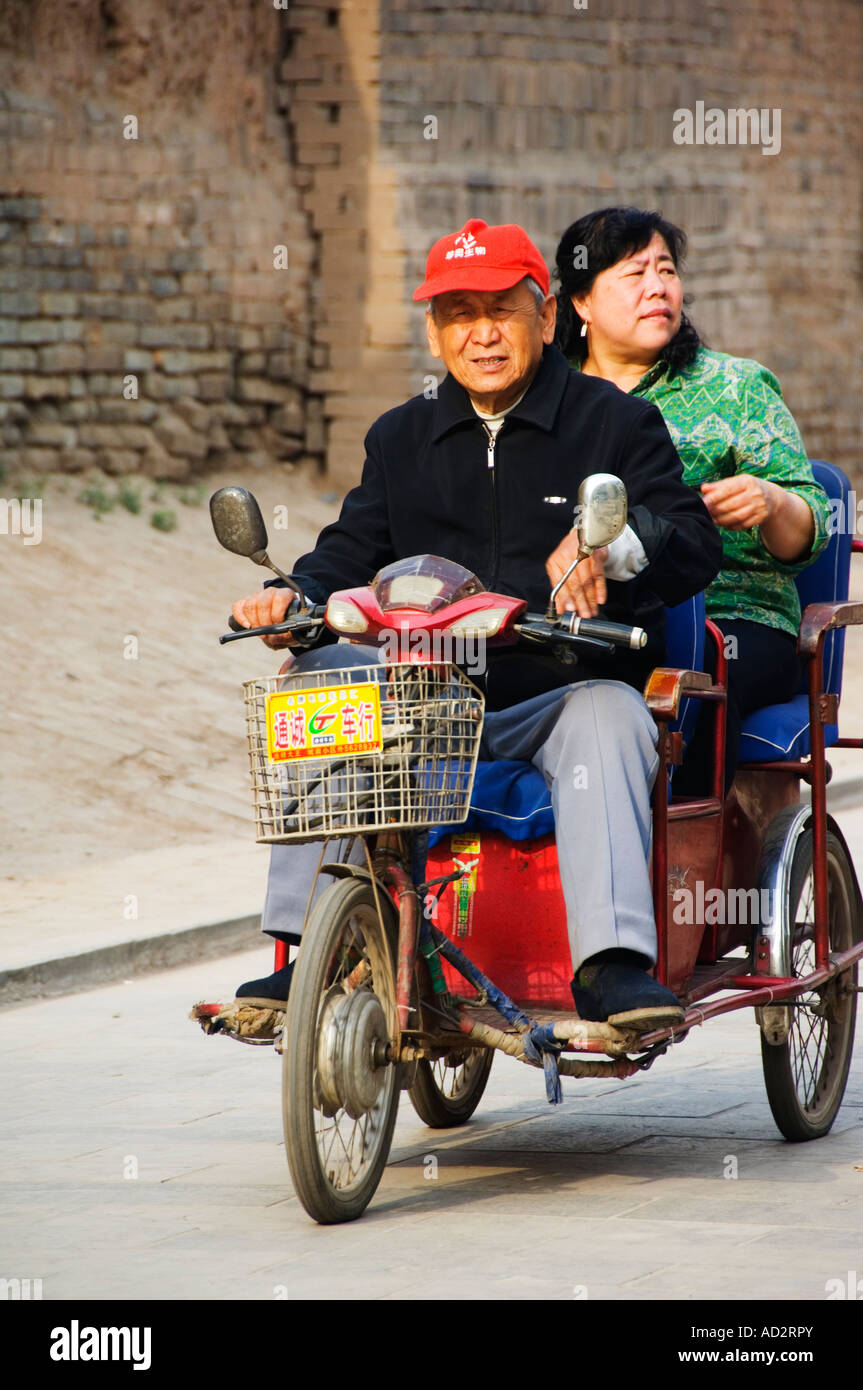 Old chinese man riding bicycle hi-res stock photography and images - Alamy