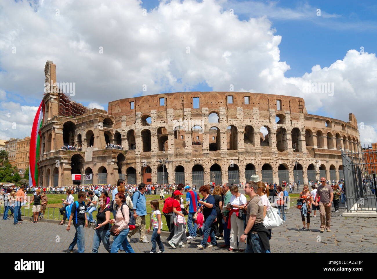 Tourists passing The Colosseum, Rome Stock Photo - Alamy