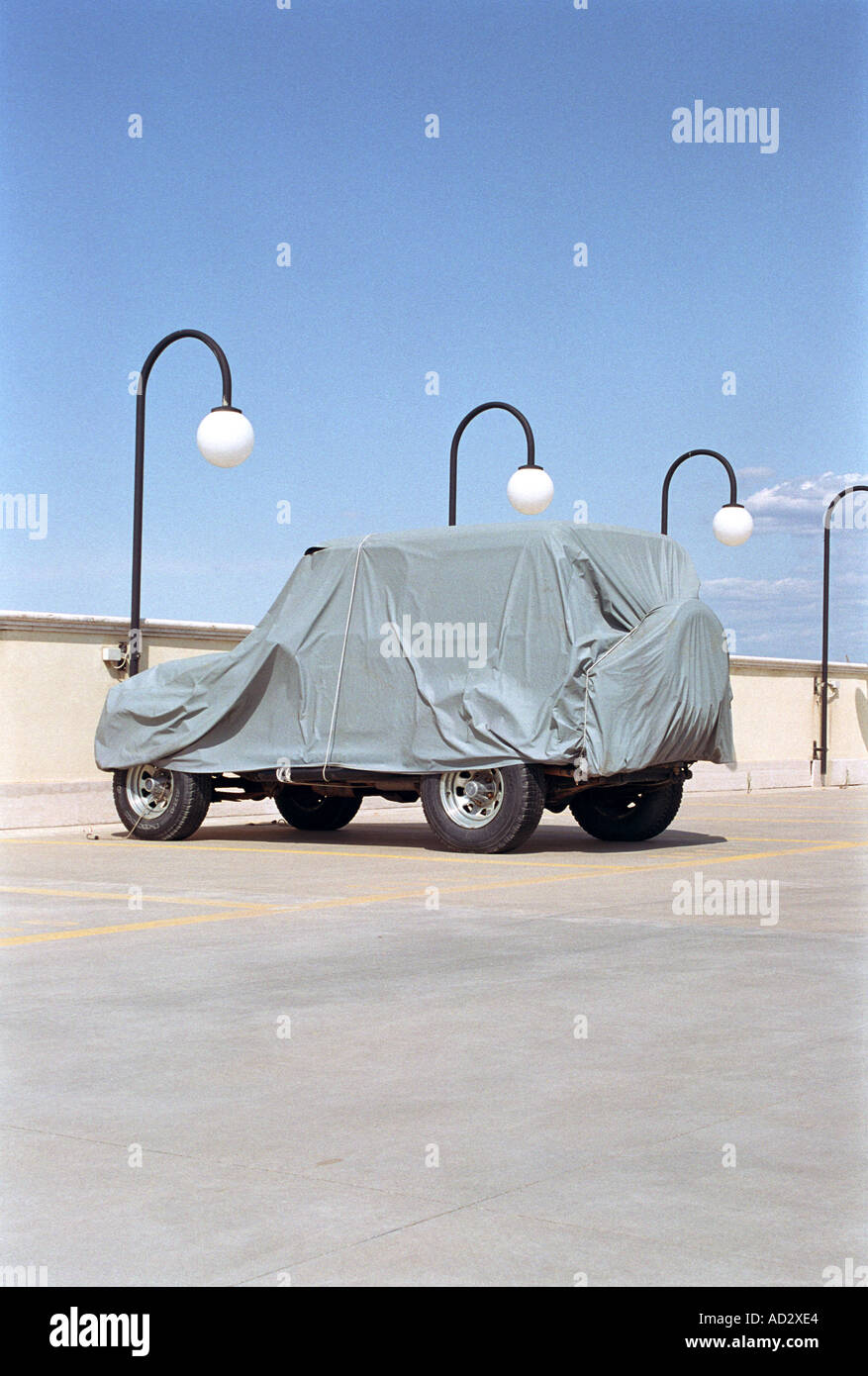 four wheel drive truck covered with tarpaulin in car park Stock Photo ...