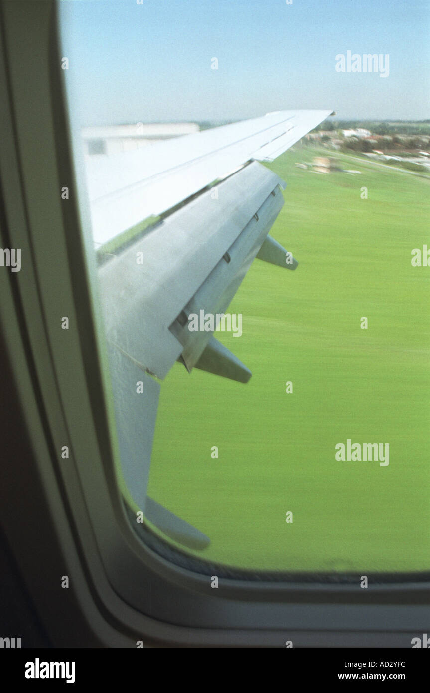 view of wing from plane window landing movement Stock Photo - Alamy