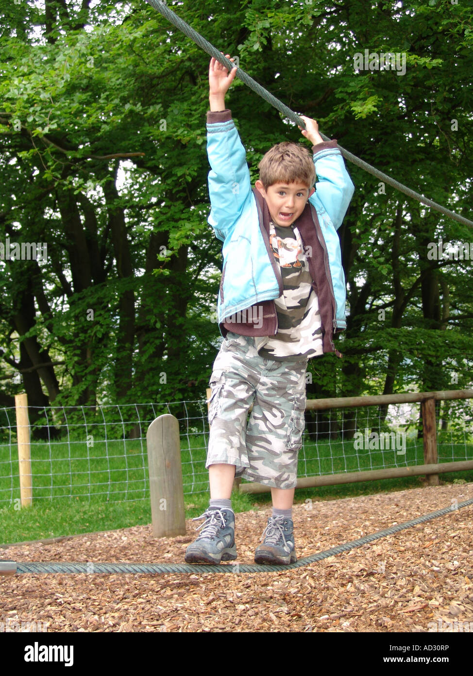 A boy playing at park Stock Photo - Alamy