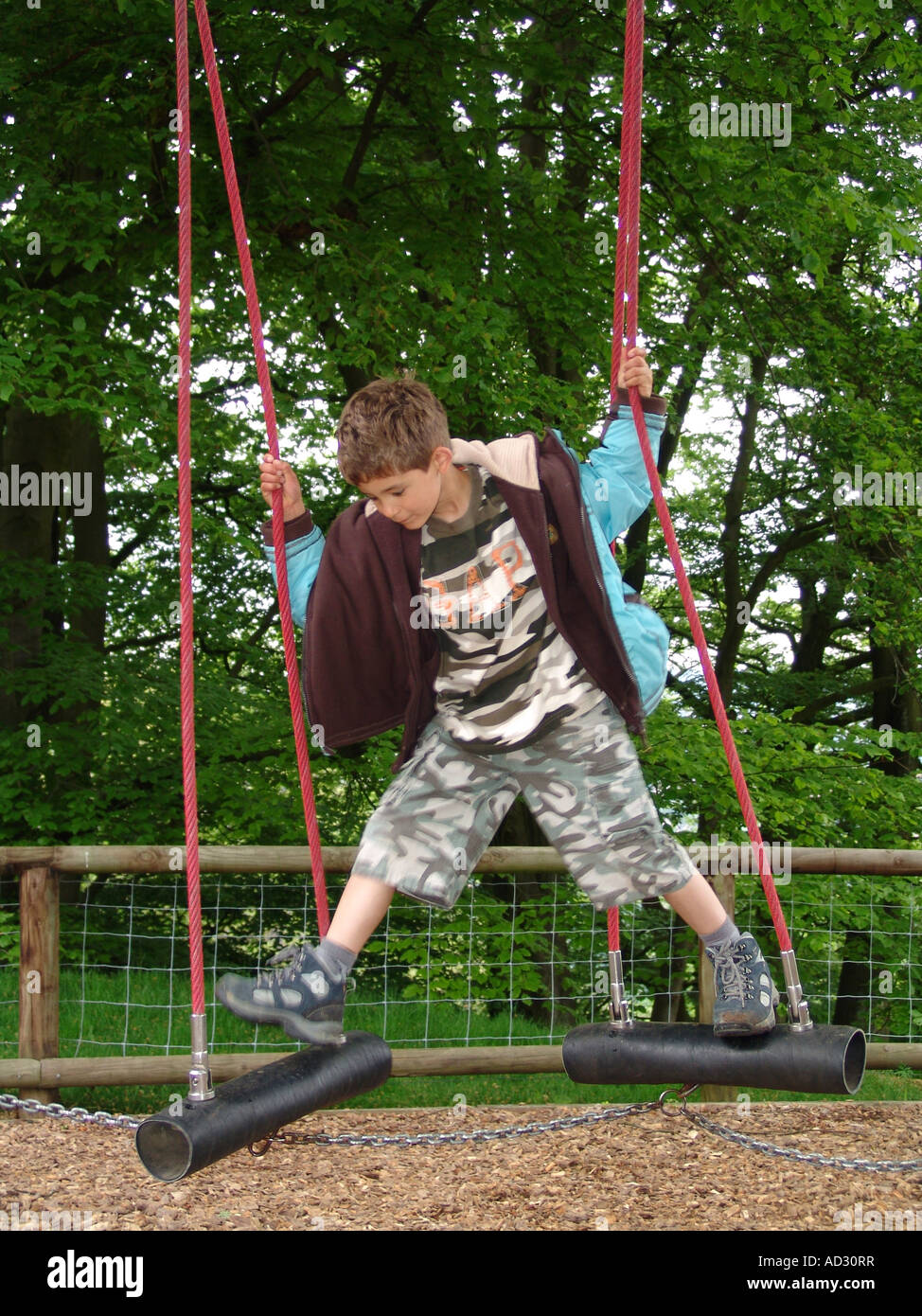 A boy playing at park Stock Photo - Alamy
