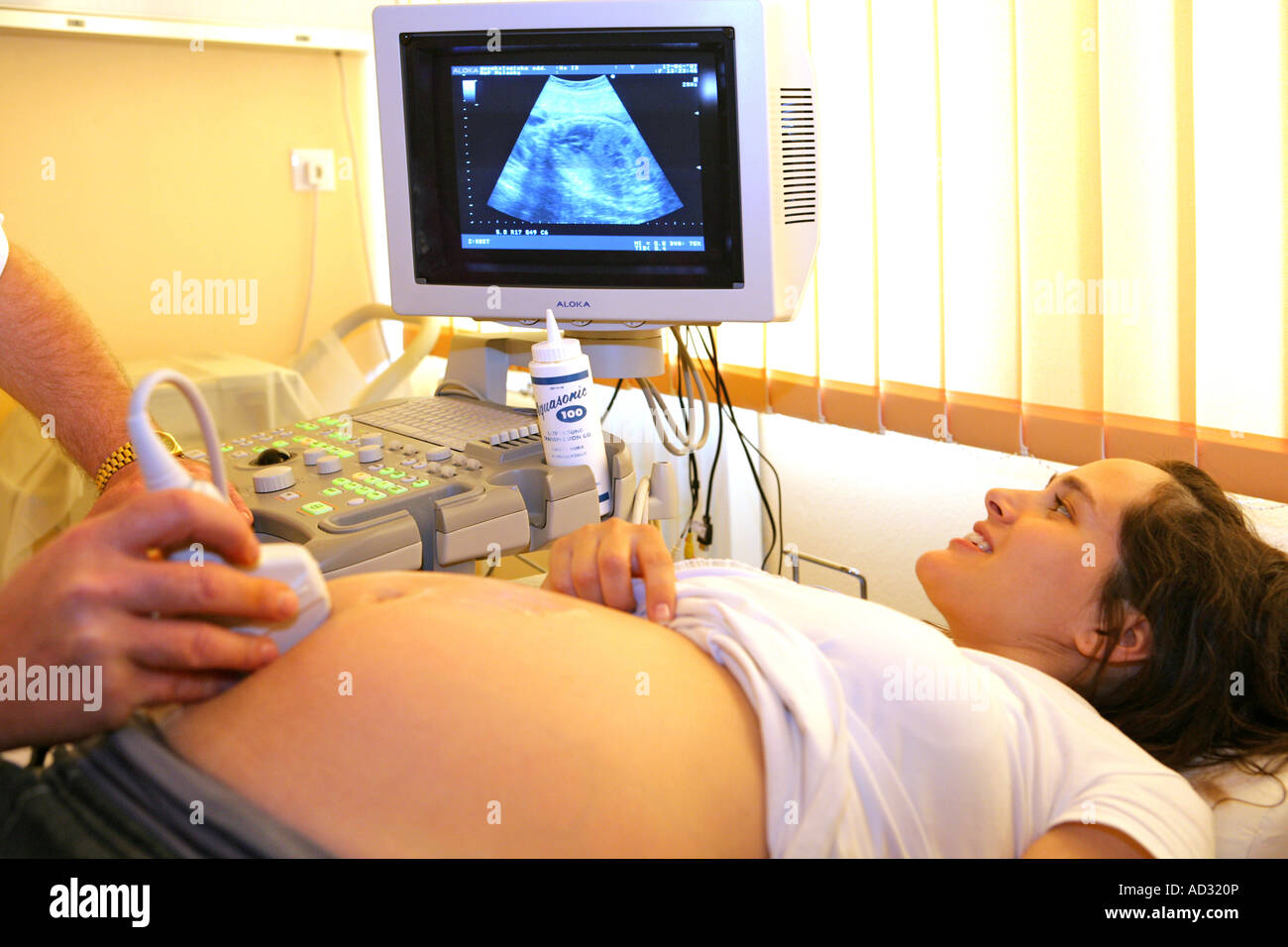 Pregnant woman getting ultrasound hi-res stock photography and images ...