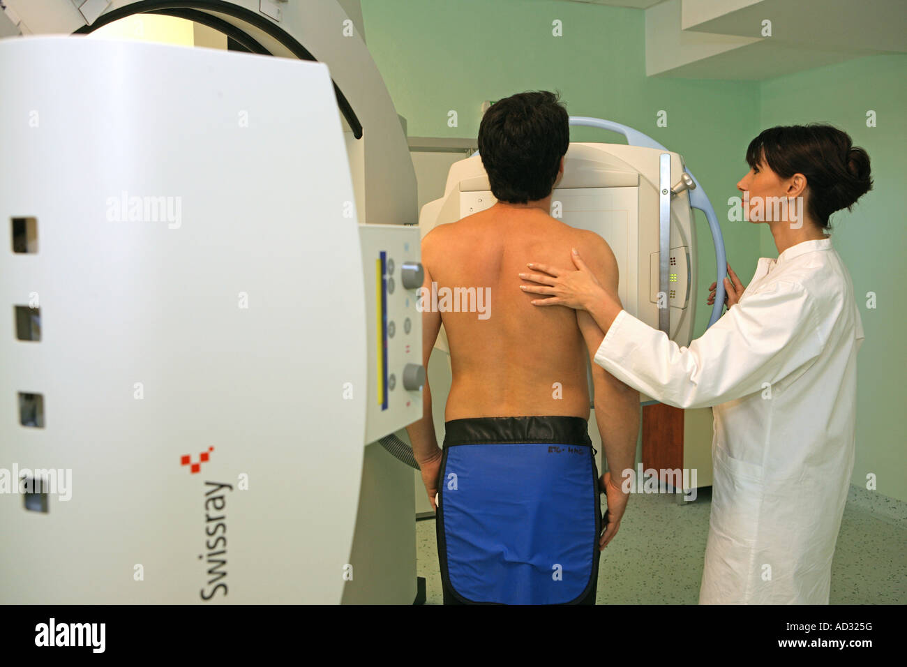 Radiographer taking x ray of patient Stock Photo - Alamy