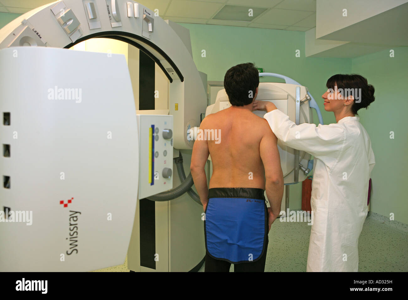 Radiographer taking x ray of patient Stock Photo - Alamy