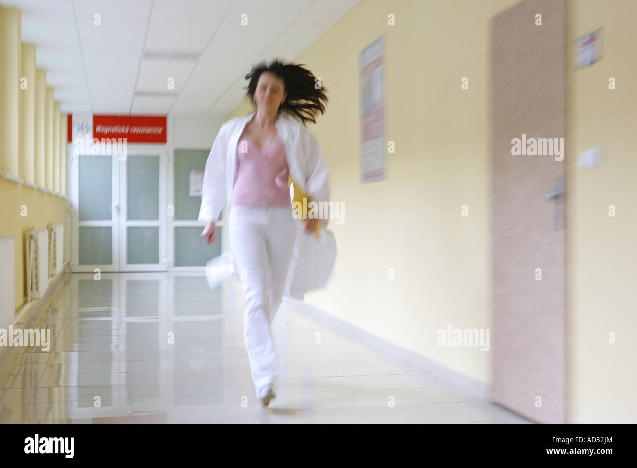 female doctor running in hospital corridor Stock Photo - Alamy