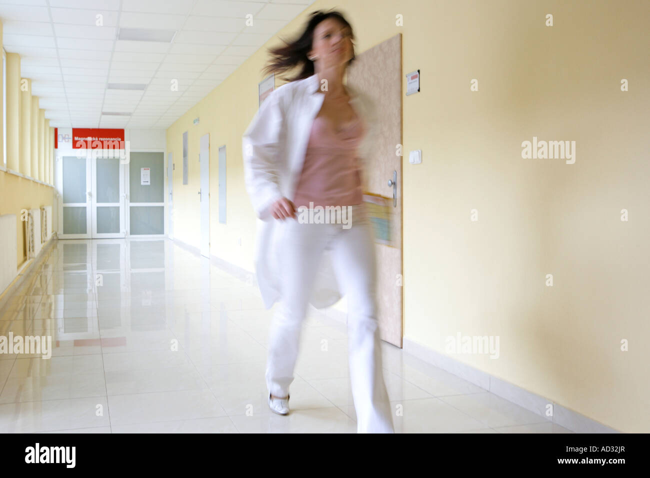 female doctor running in hospital corridor Stock Photo - Alamy