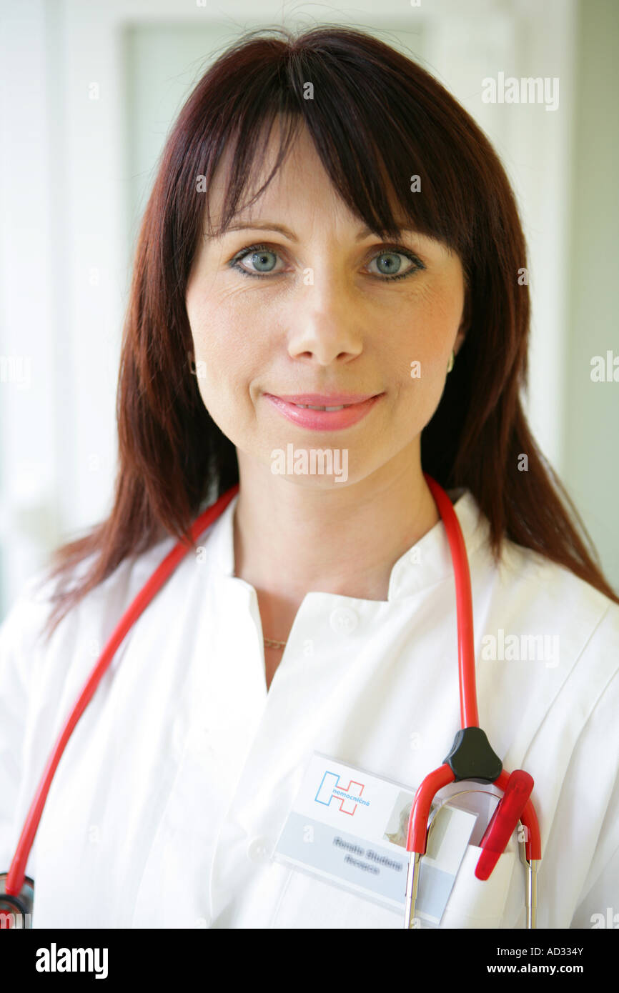 Female doctor standing in hospital corridor Stock Photo - Alamy