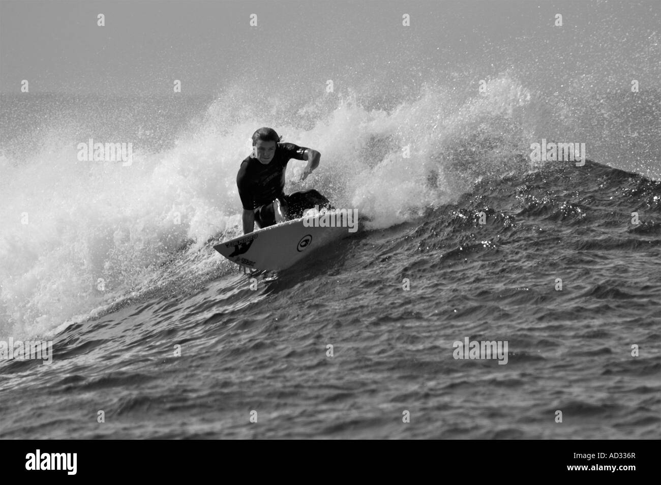 British Surfer, Tom Lowe surfing at Pipeline, a reef breaking wave off ...