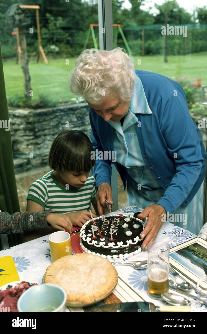 Grandmother and grandson with birthday cake Stock Photo - Alamy