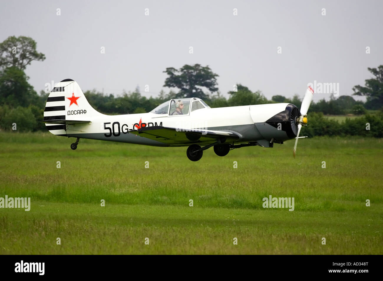 A russian Yakovlev Yak aerobatic aircraft just getting airborne Stock ...