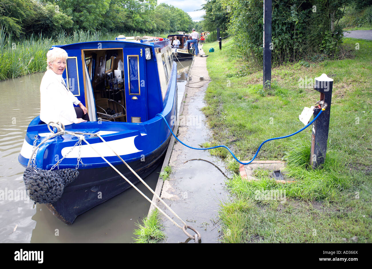 Narrowboat taking on water at a water point on the Ashby Canal Stock ...