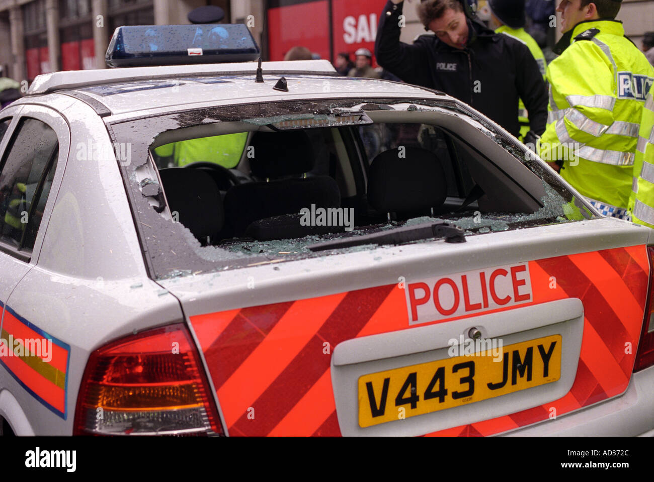 Police car with smashed in rear window from rioter during May day ...