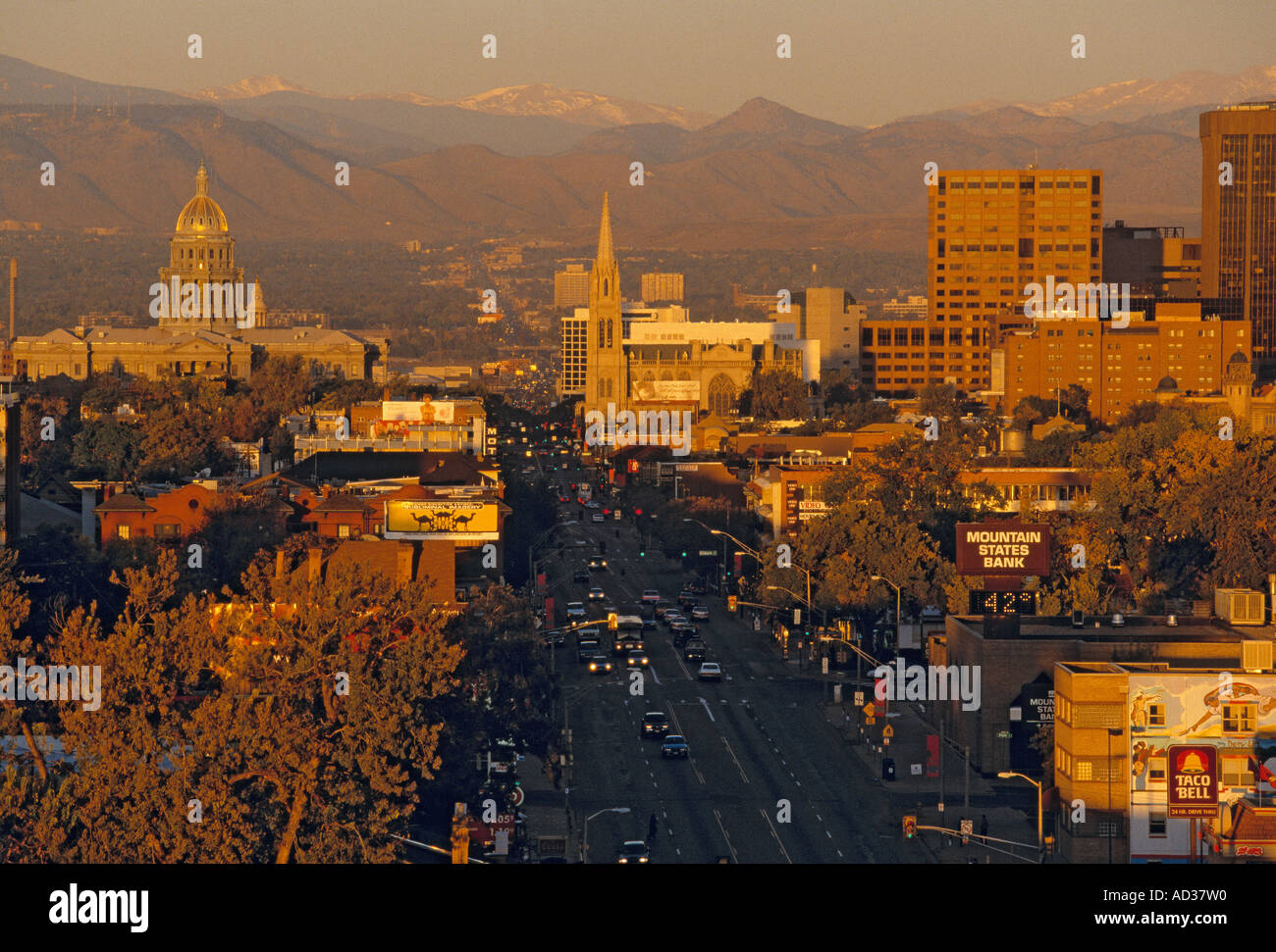 A view down Colfax Avenue with the state capitol of Colorado, downtown ...