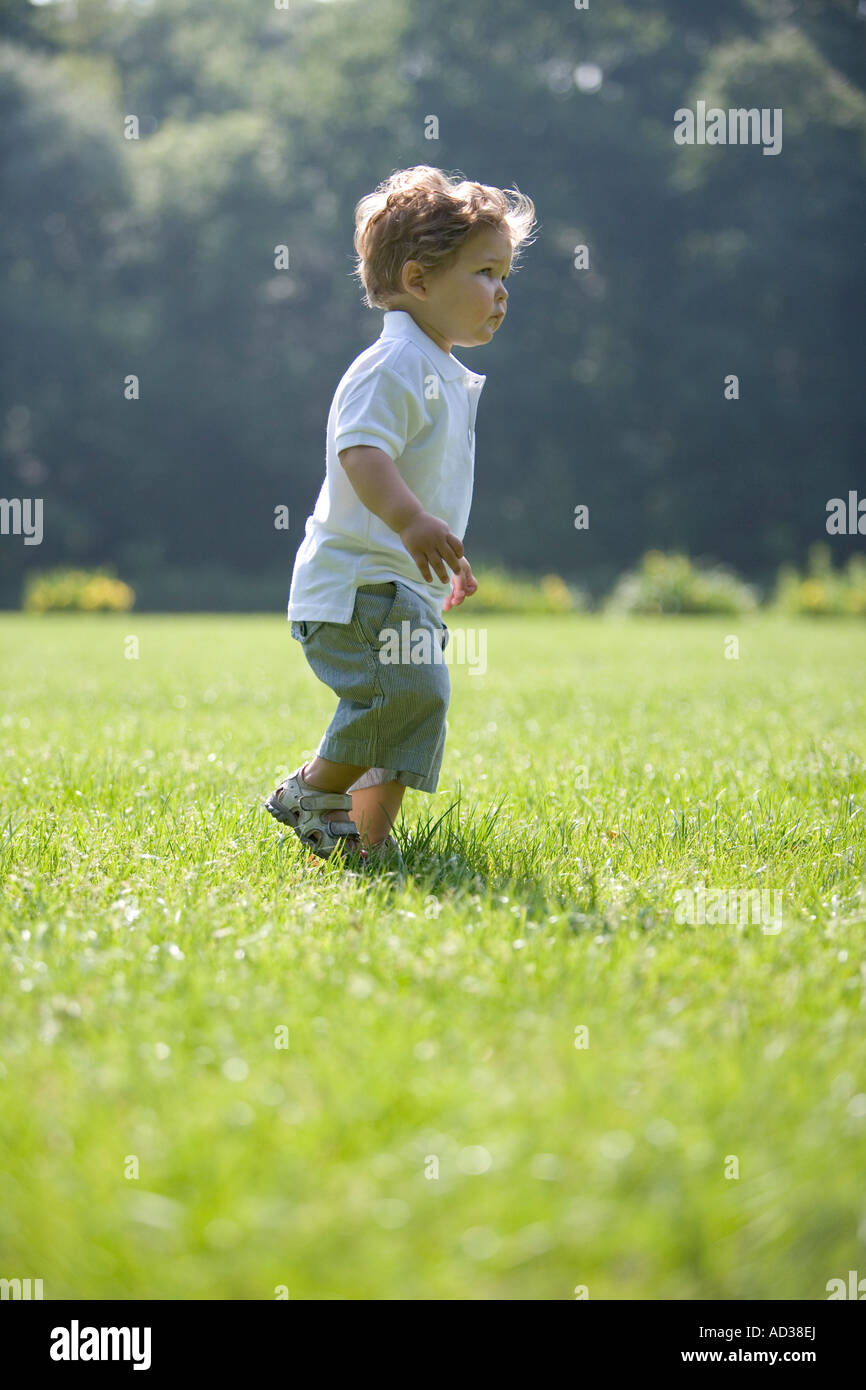 Little boy walking in the parc Stock Photo - Alamy