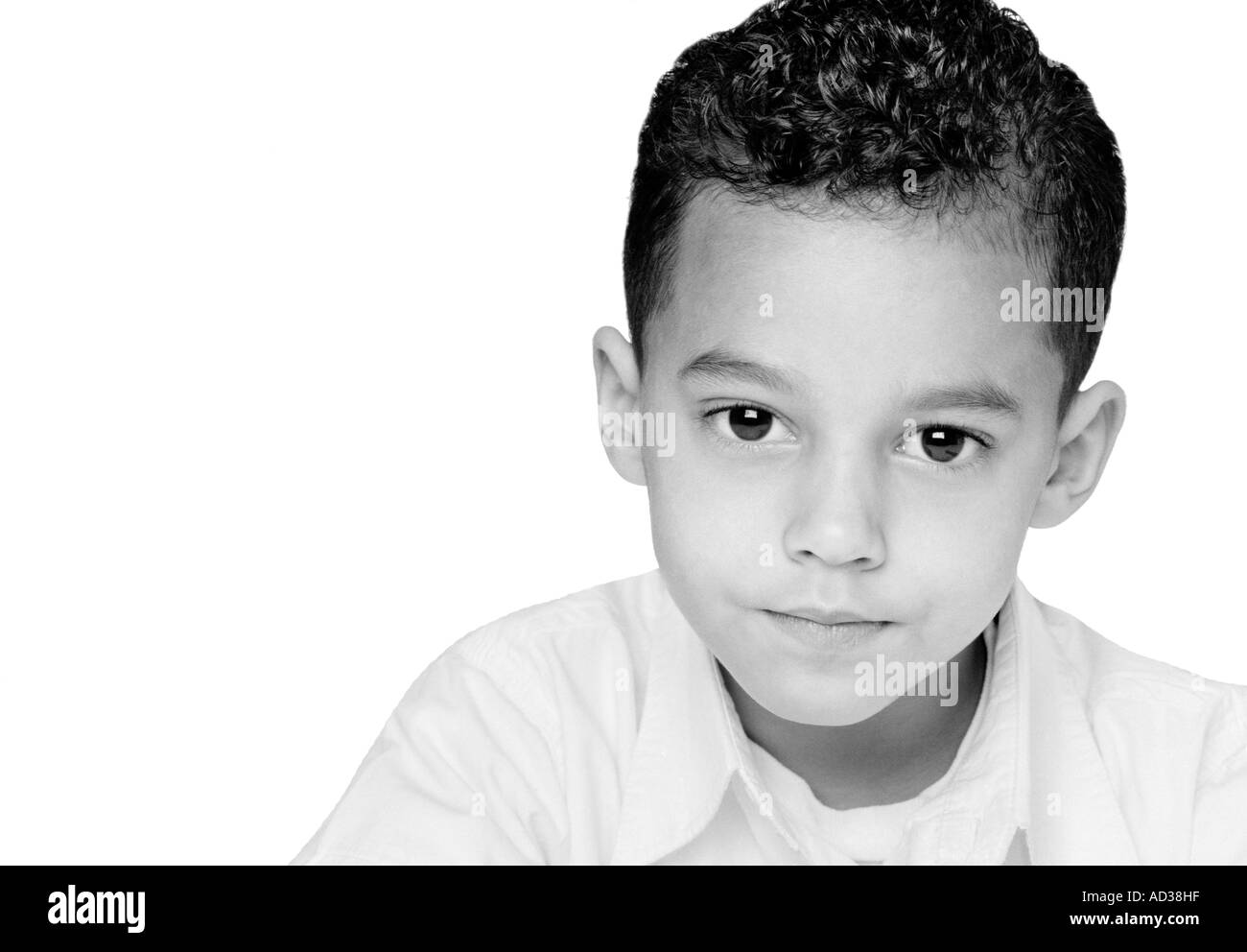 Black and white photo of a young boy with a serious look on his face ...