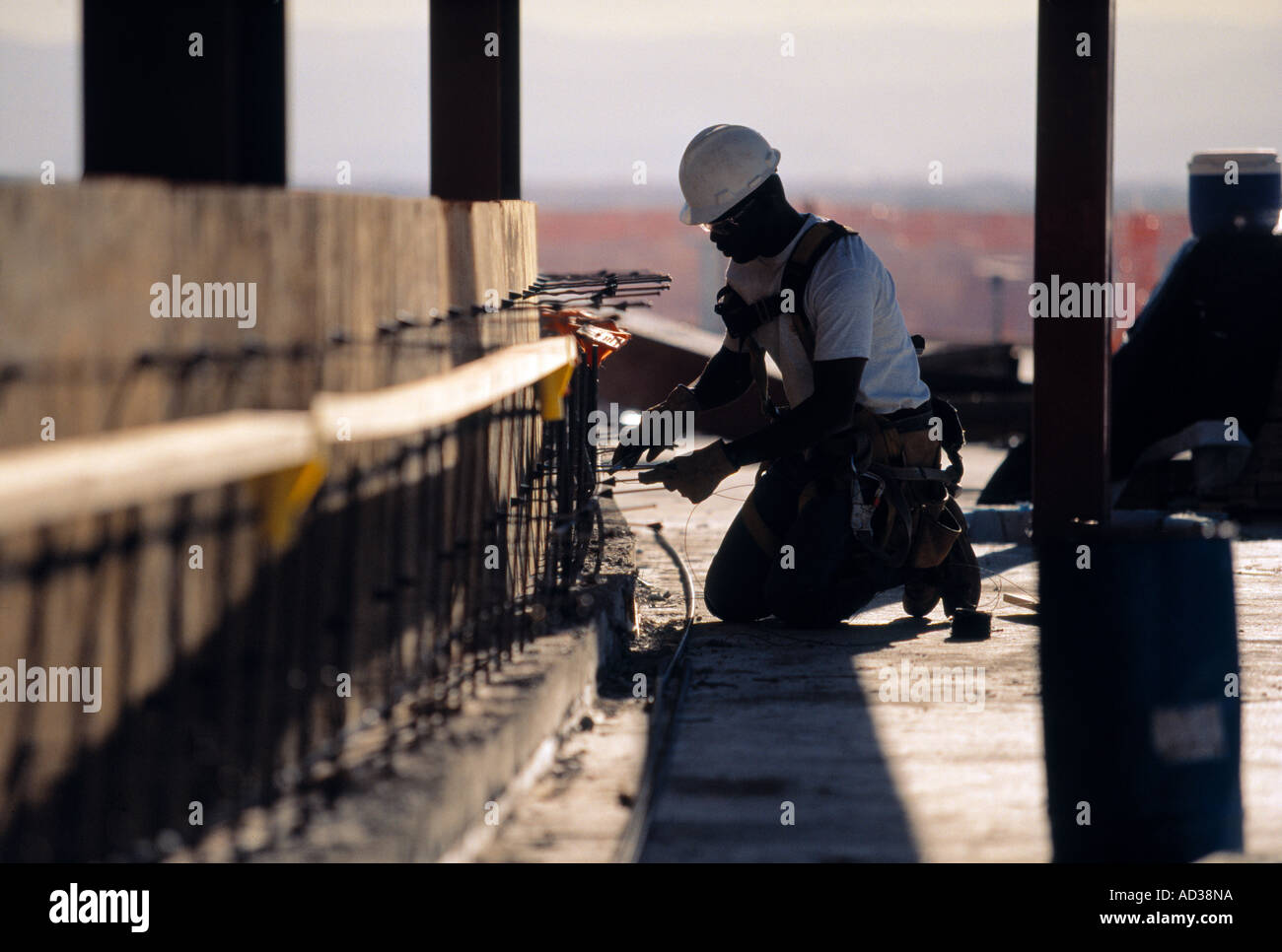 Construction worker working on a high rise building Stock Photo - Alamy
