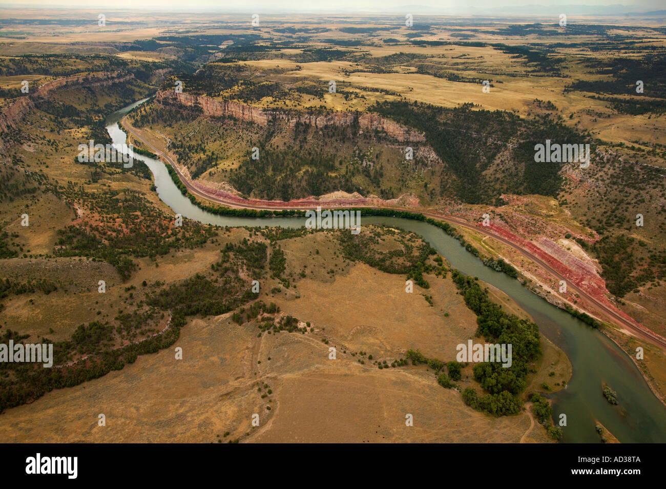 Aerial photo of river winding past red rock cliffs in Wyoming, USA ...