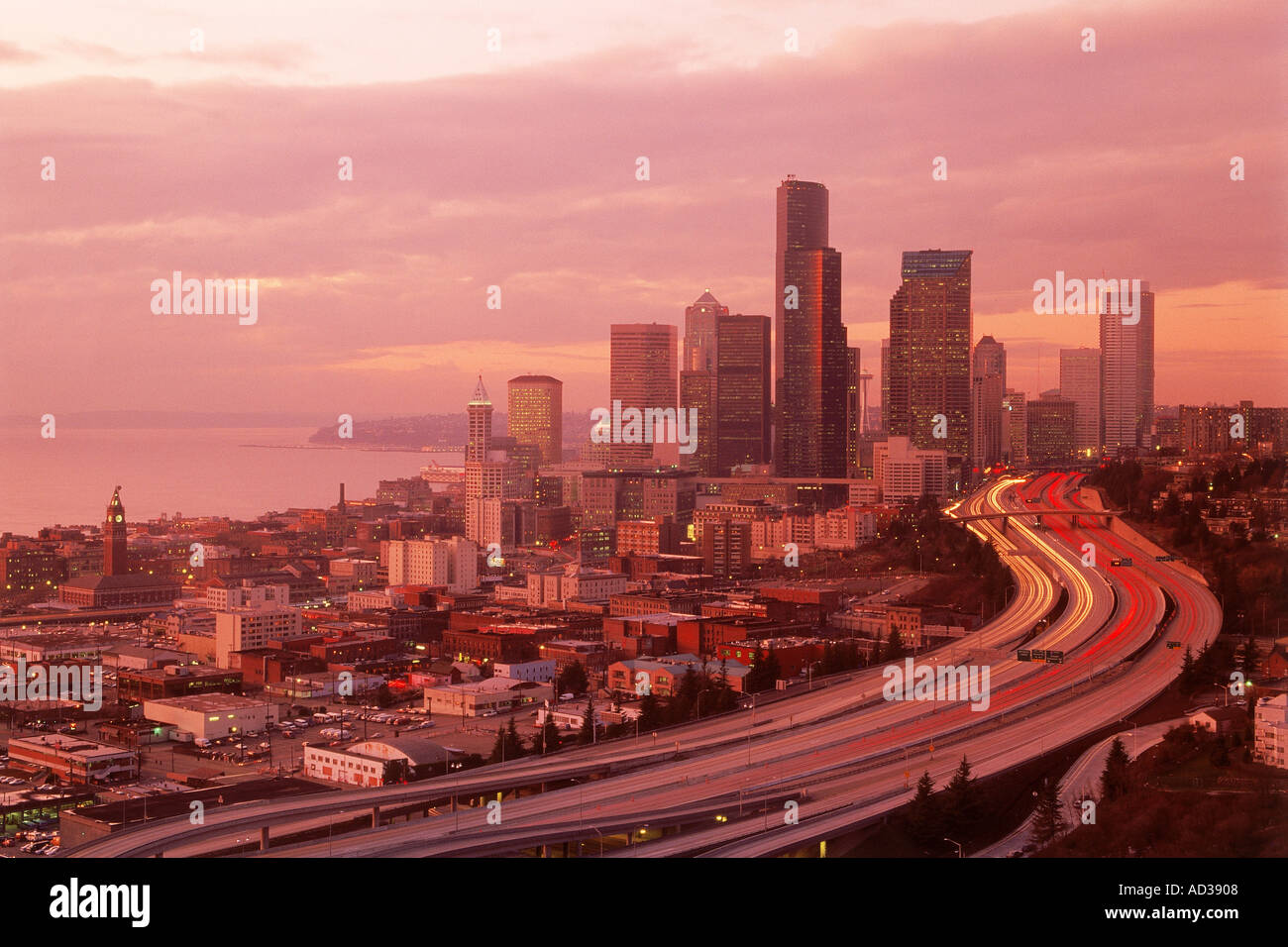 Traffic lanes and Seattle skyline under sunset skies Stock Photo - Alamy