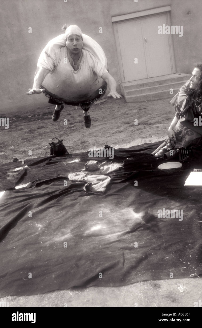 Fellini style fat man in mid air Stock Photo - Alamy