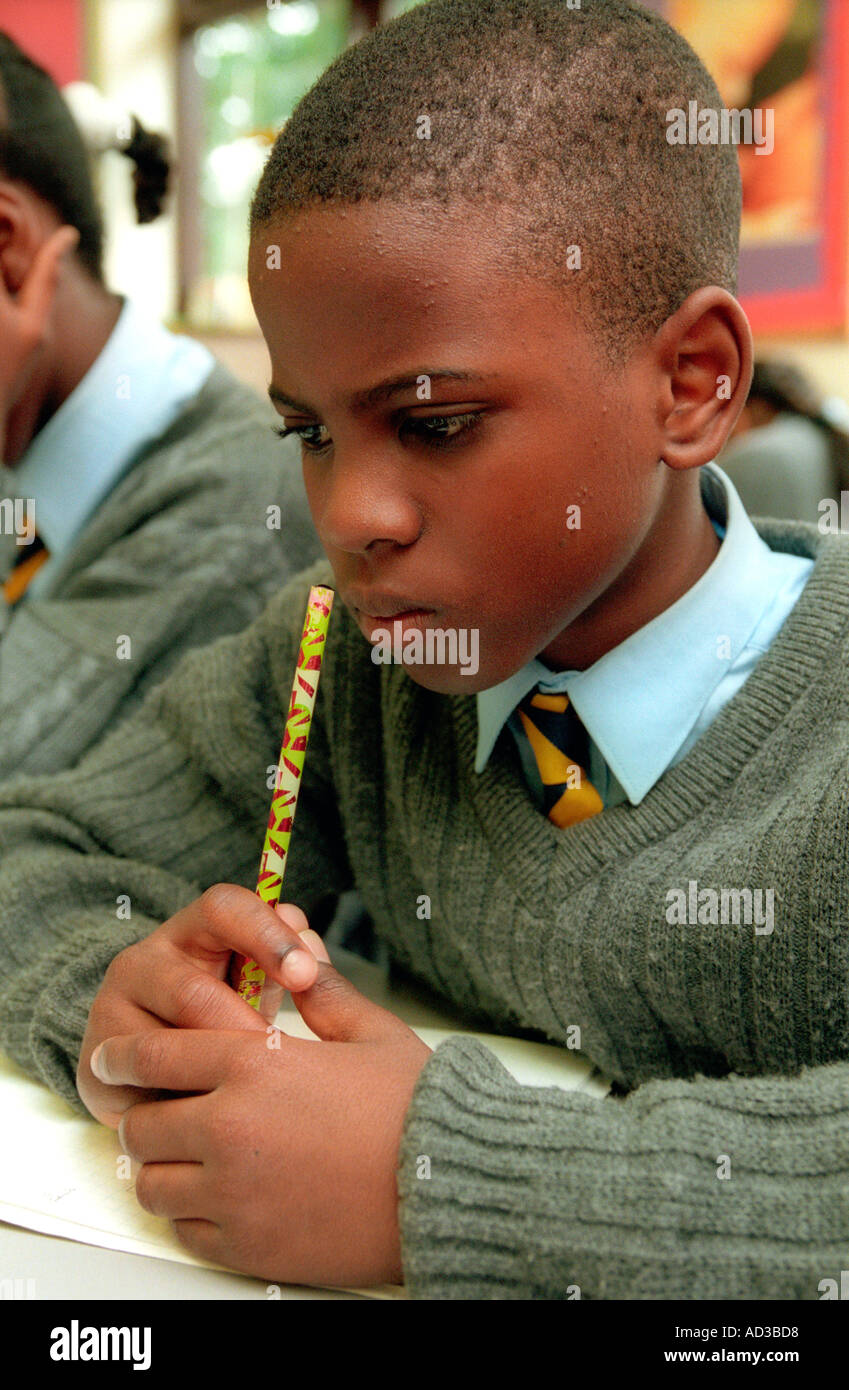 African boy thinking uniform hi-res stock photography and images - Alamy