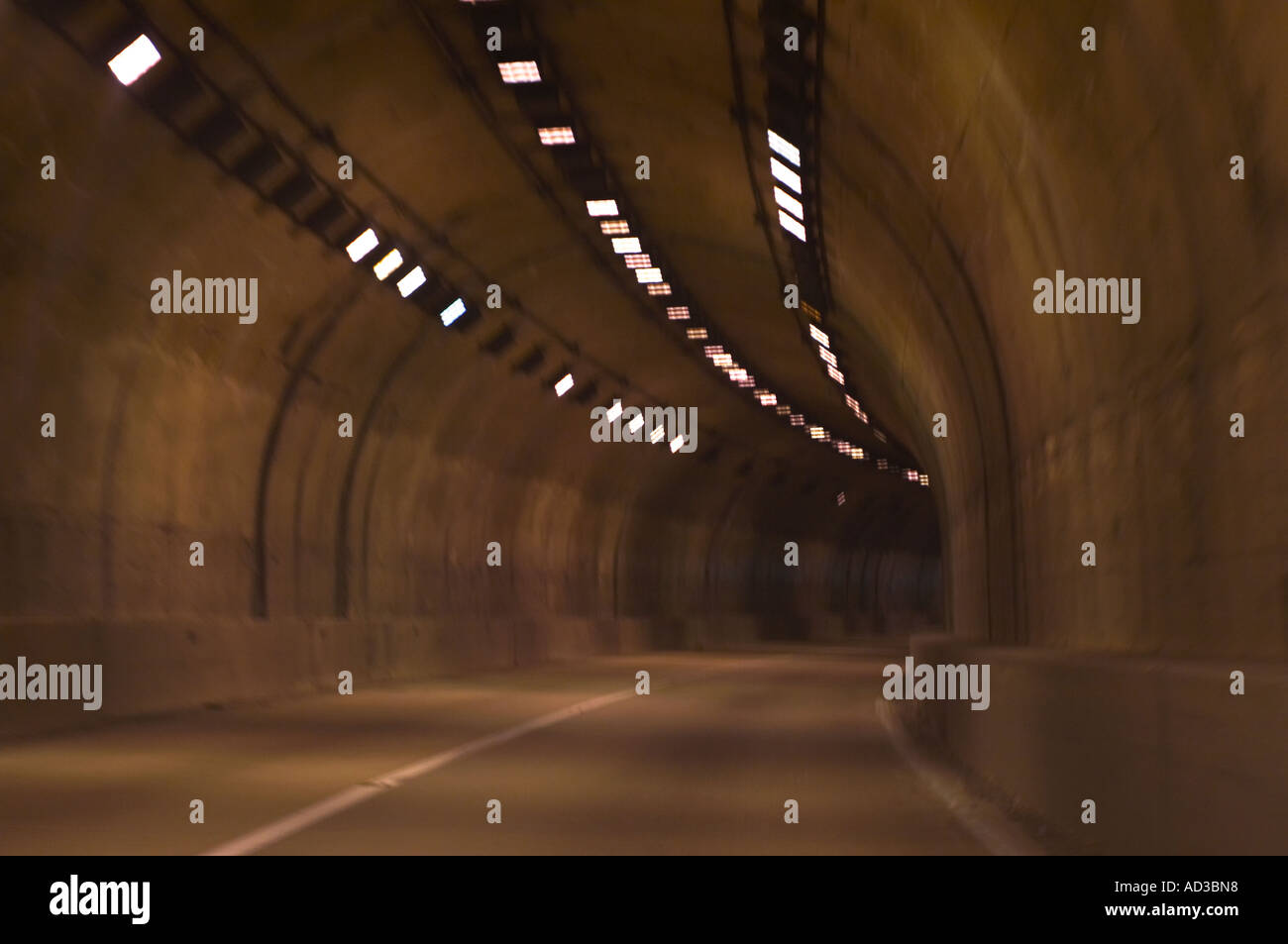 A road going through a tunnel Stock Photo - Alamy