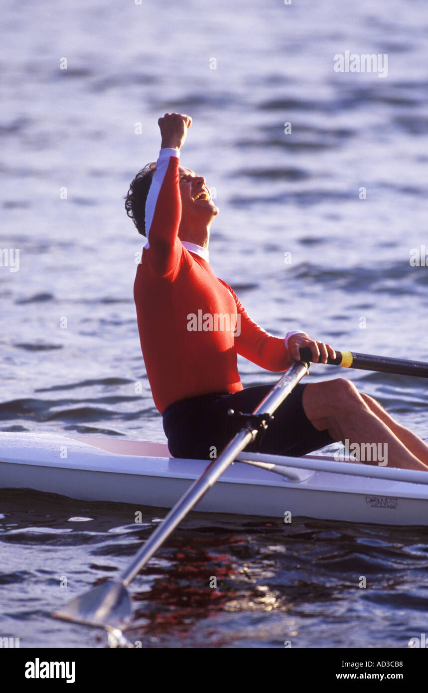 Rower in triumphant pose after workout Stock Photo - Alamy
