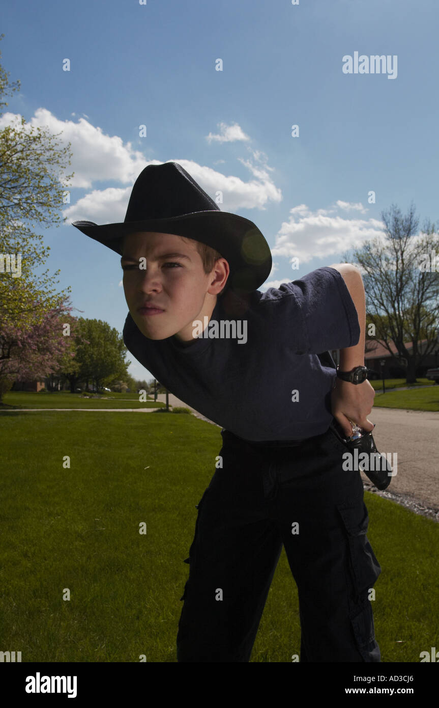 A young boy playing cowboy Stock Photo - Alamy