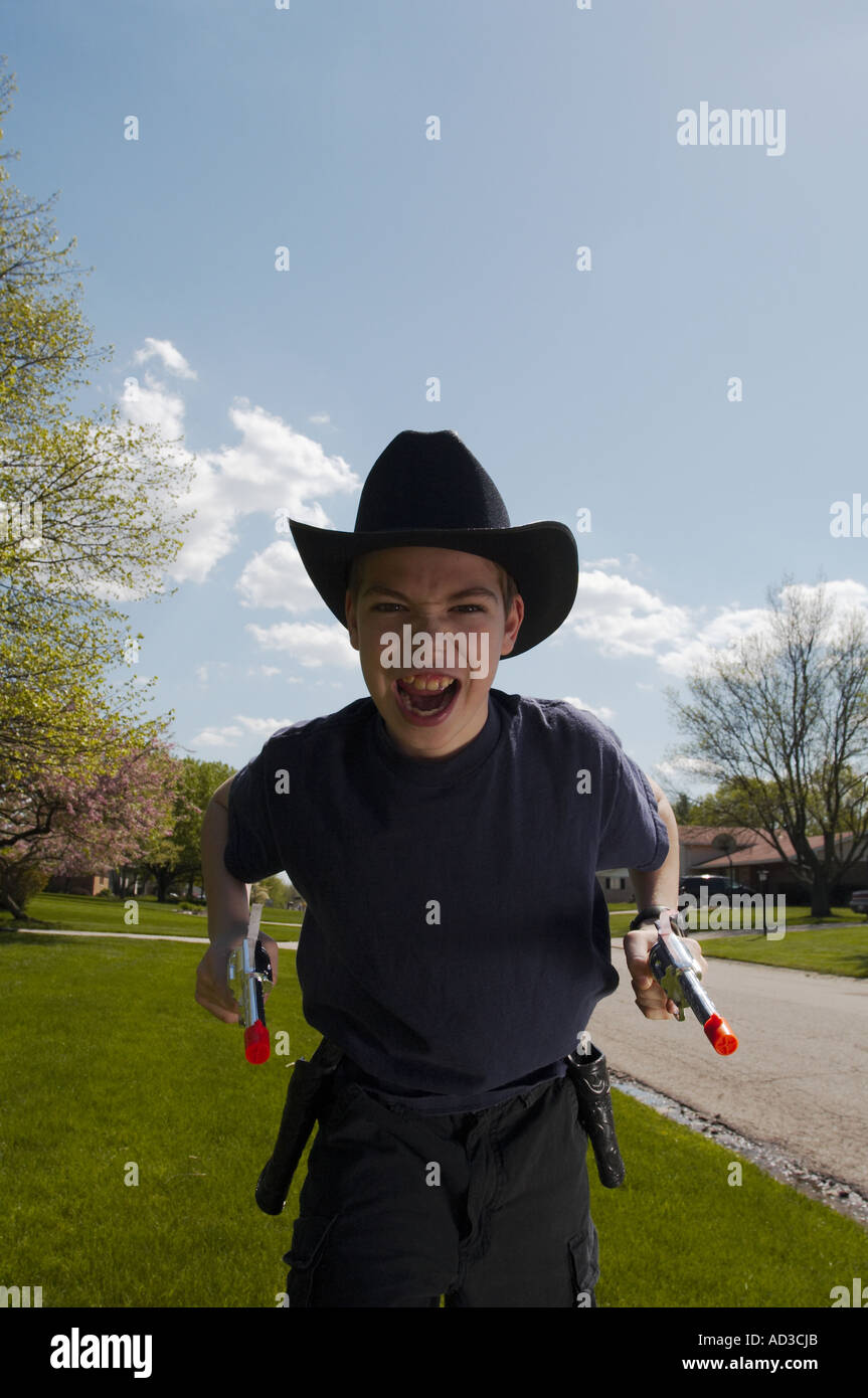 A young boy playing cowboy Stock Photo - Alamy