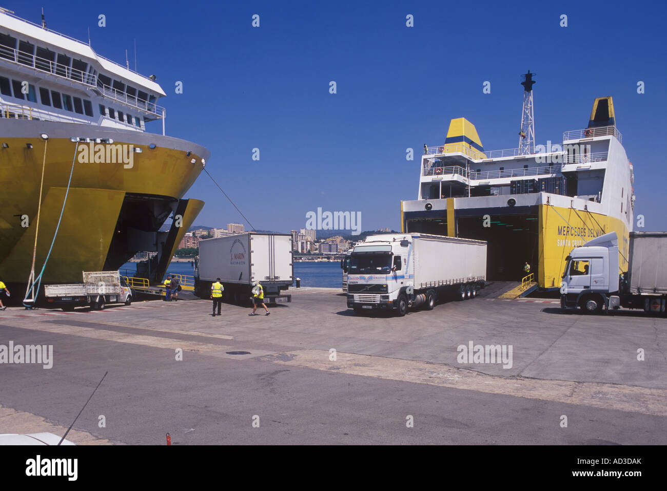 Cargo operations, lorries and containers being loaded onto ferries in ...